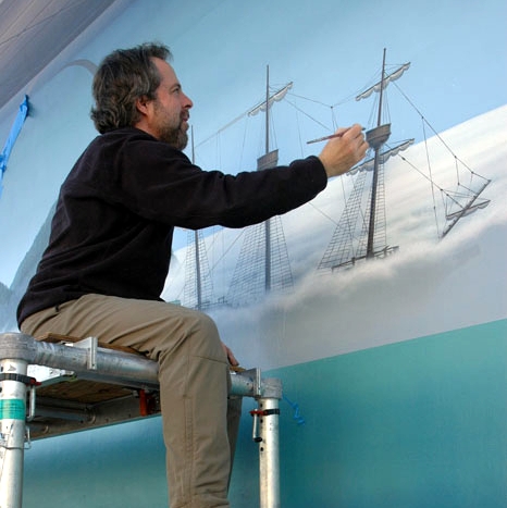 trompe l oeil muralist john pugh painting a ship on scaffolding for a ...